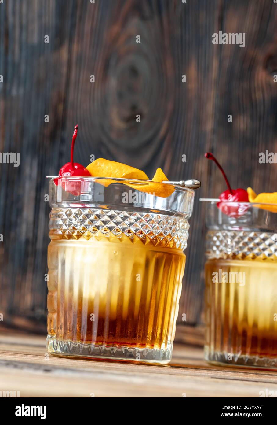 Two glasses of old fashioned cocktail Stock Photo - Alamy