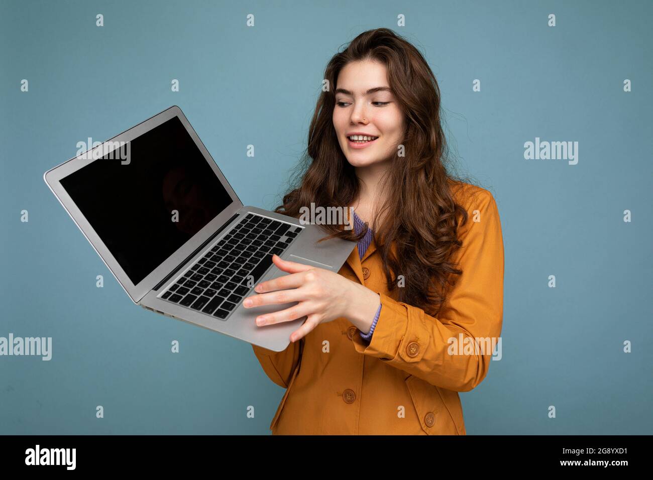 Close-up portrait of Beautiful smiling happy young woman holding ...