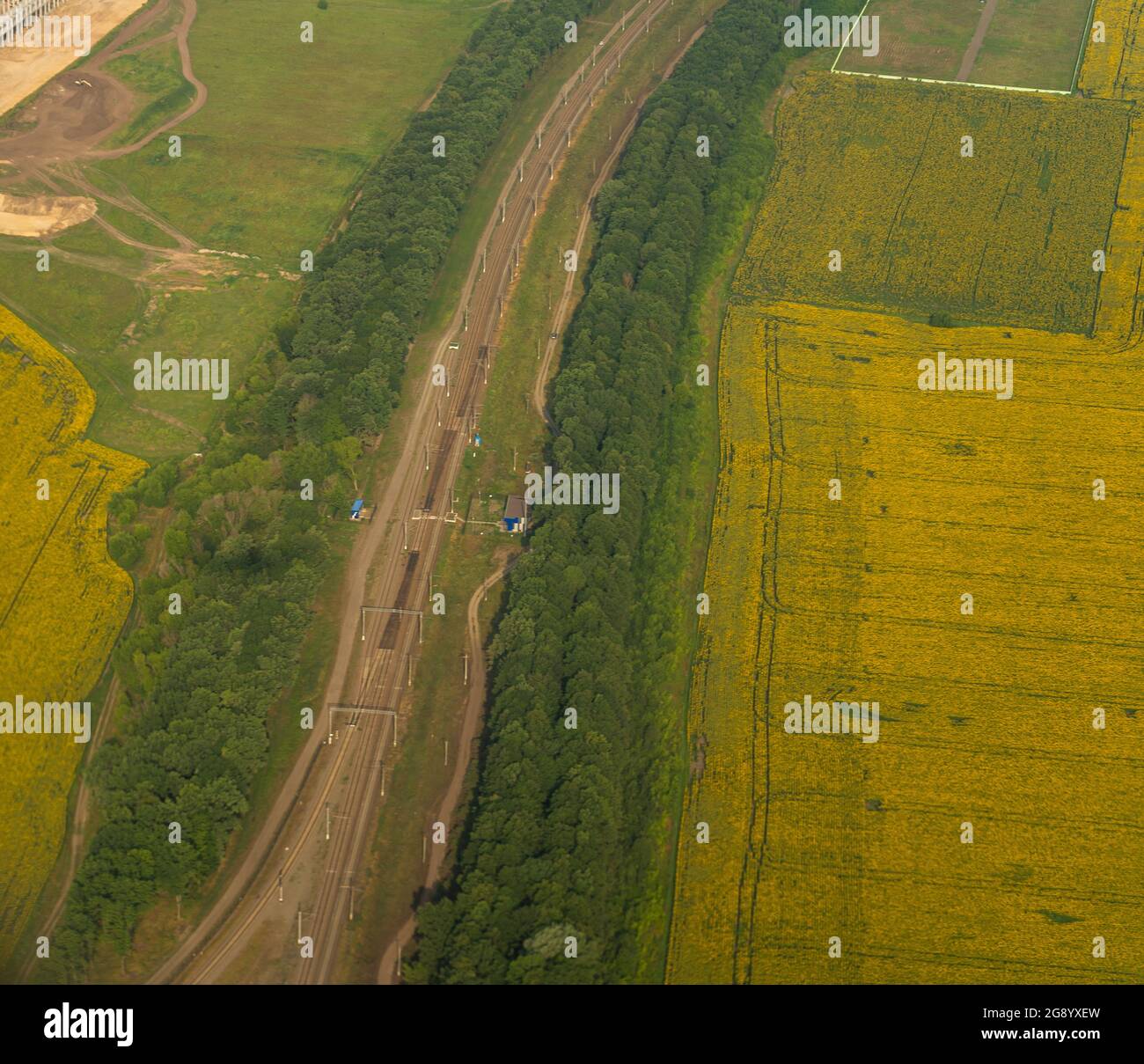 Land view through the airplane window. Fields, roads, rivers from a ...
