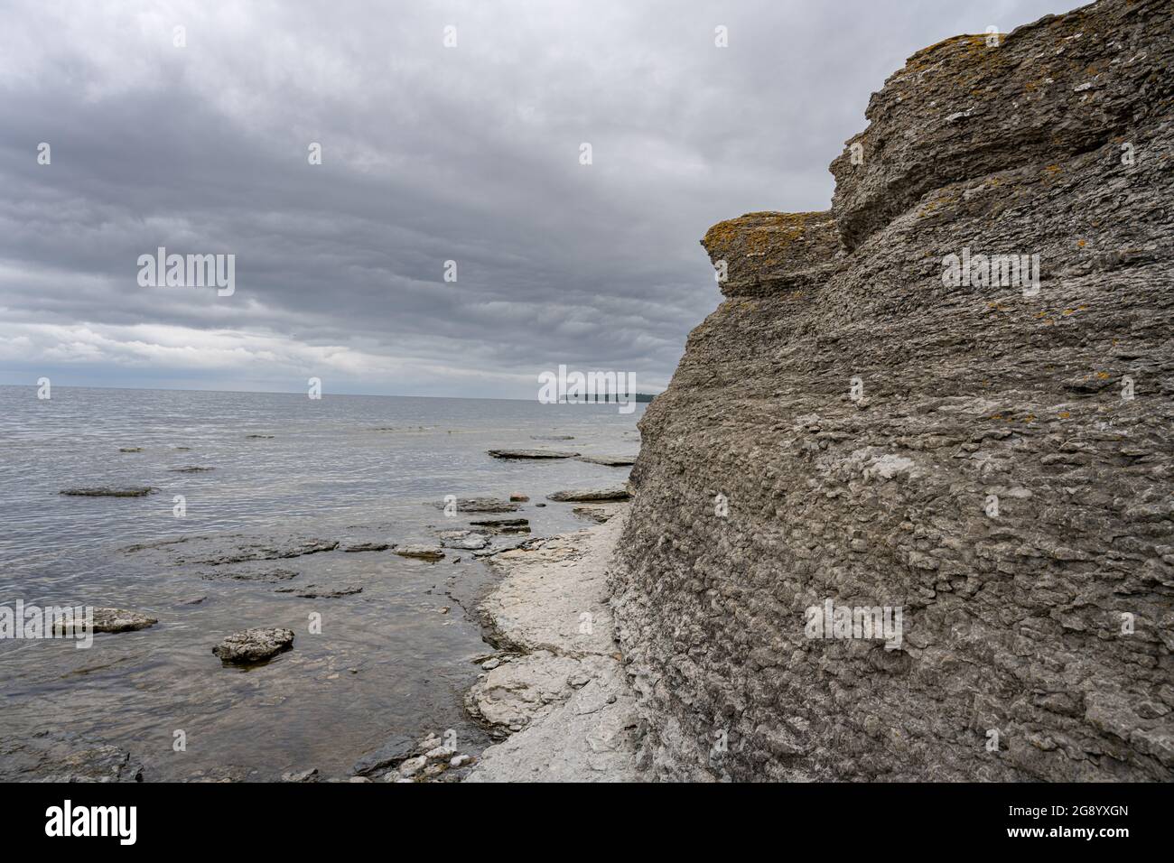 A beautiful limestone formation with a dramatic sky in the background ...