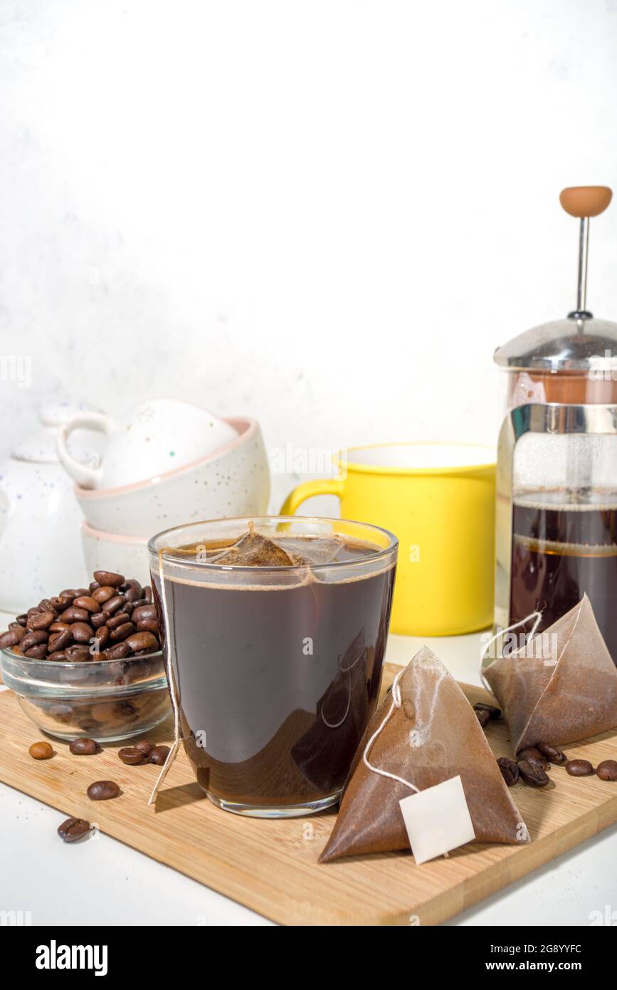 Instant freshly brewed cup of coffee from bag. Trendy variety of drip ...