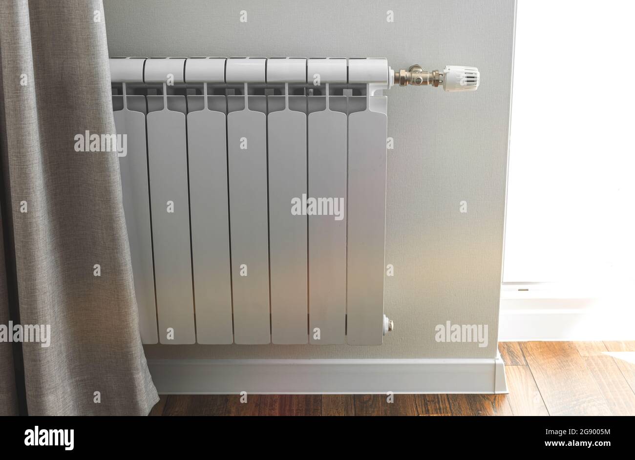 Heating white radiator radiator in living room interior photo Stock ...
