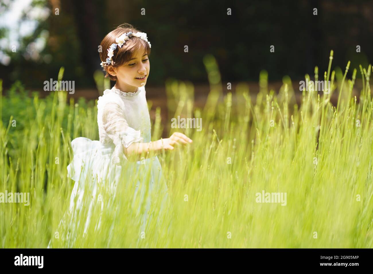 Child touching grass hi-res stock photography and images - Alamy
