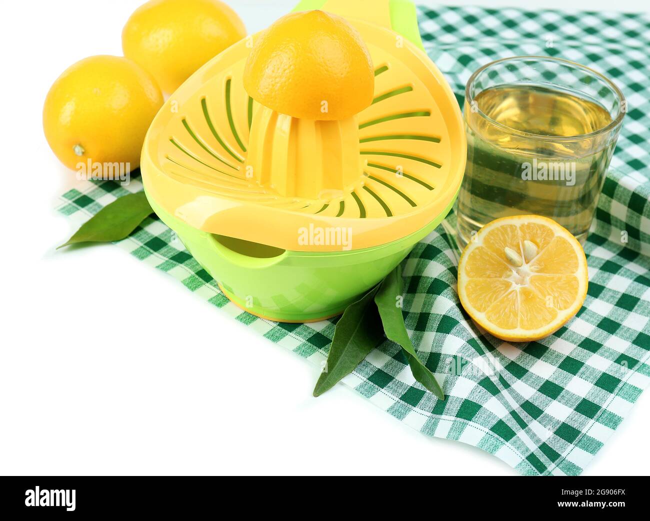 Citrus press and lemons isolated on white Stock Photo - Alamy