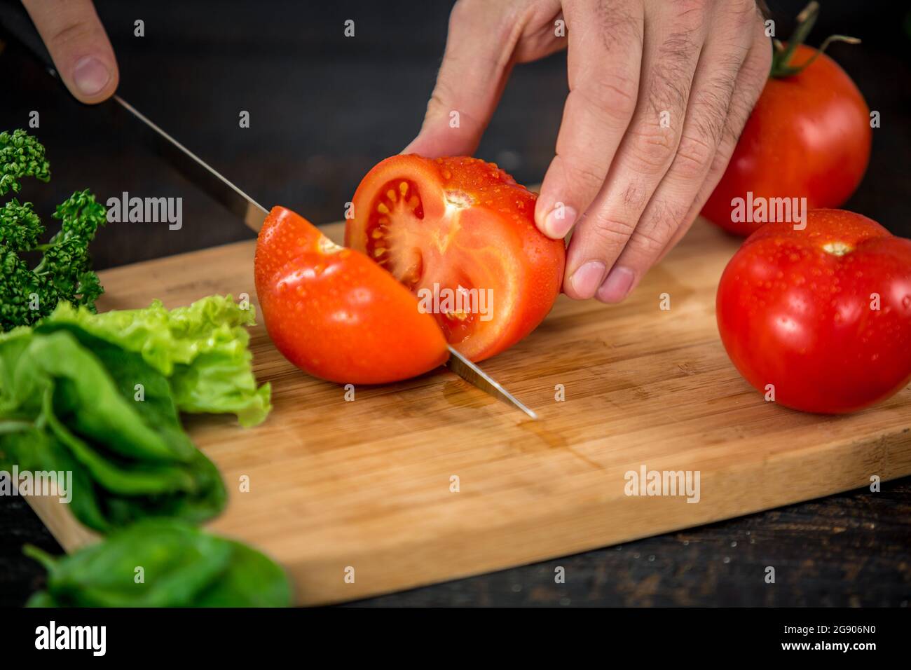 Male hands cutting vegetables for salad Stock Photo - Alamy