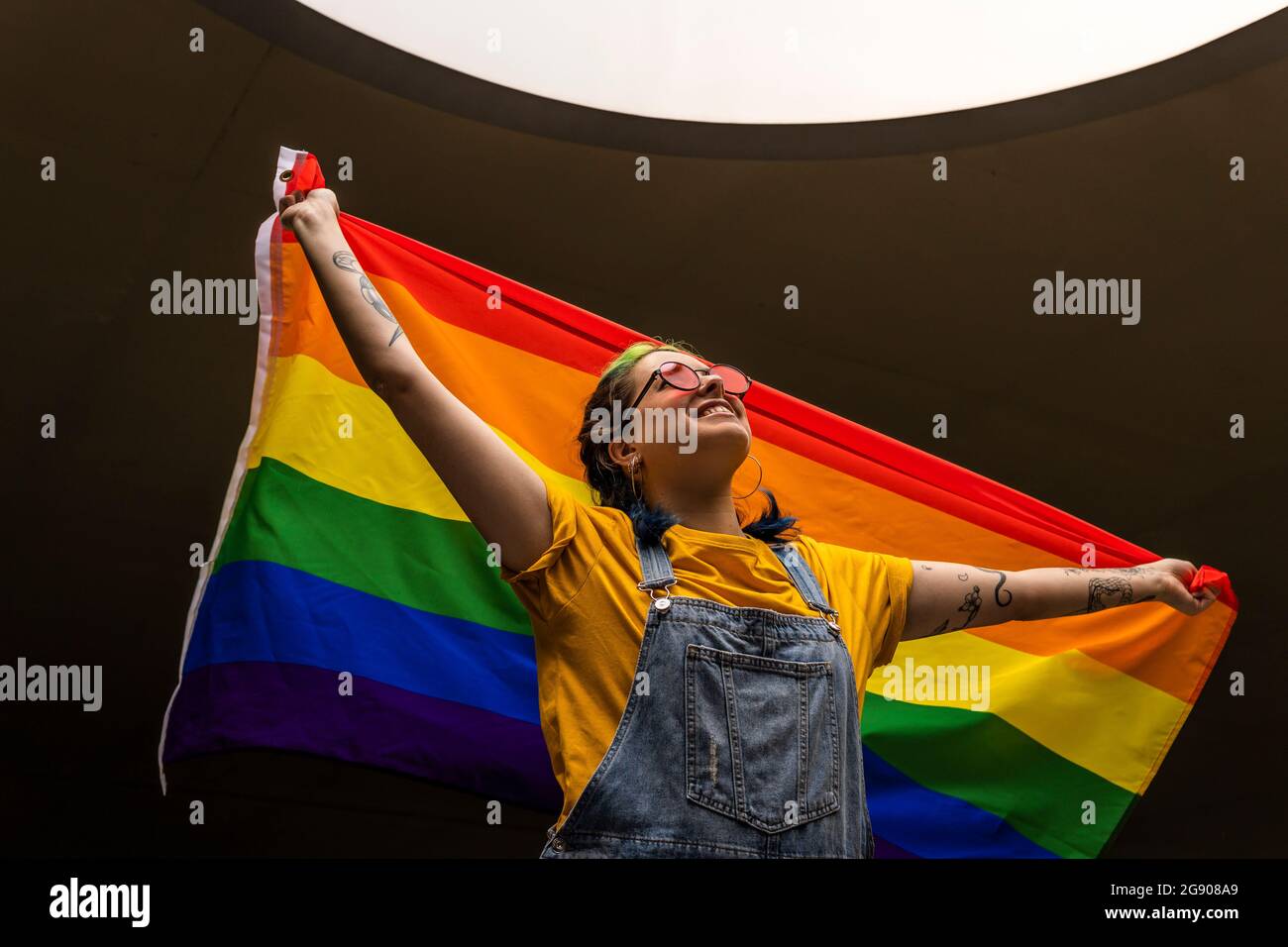 Holding up the flag hi-res stock photography and images - Alamy