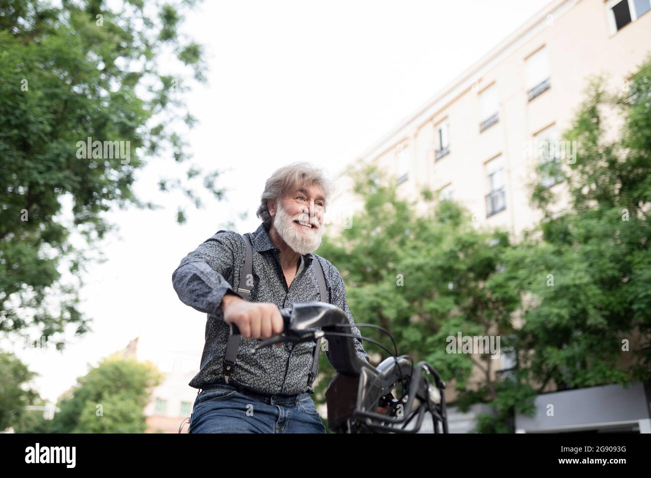 Man riding an electric bike hi-res stock photography and images - Alamy