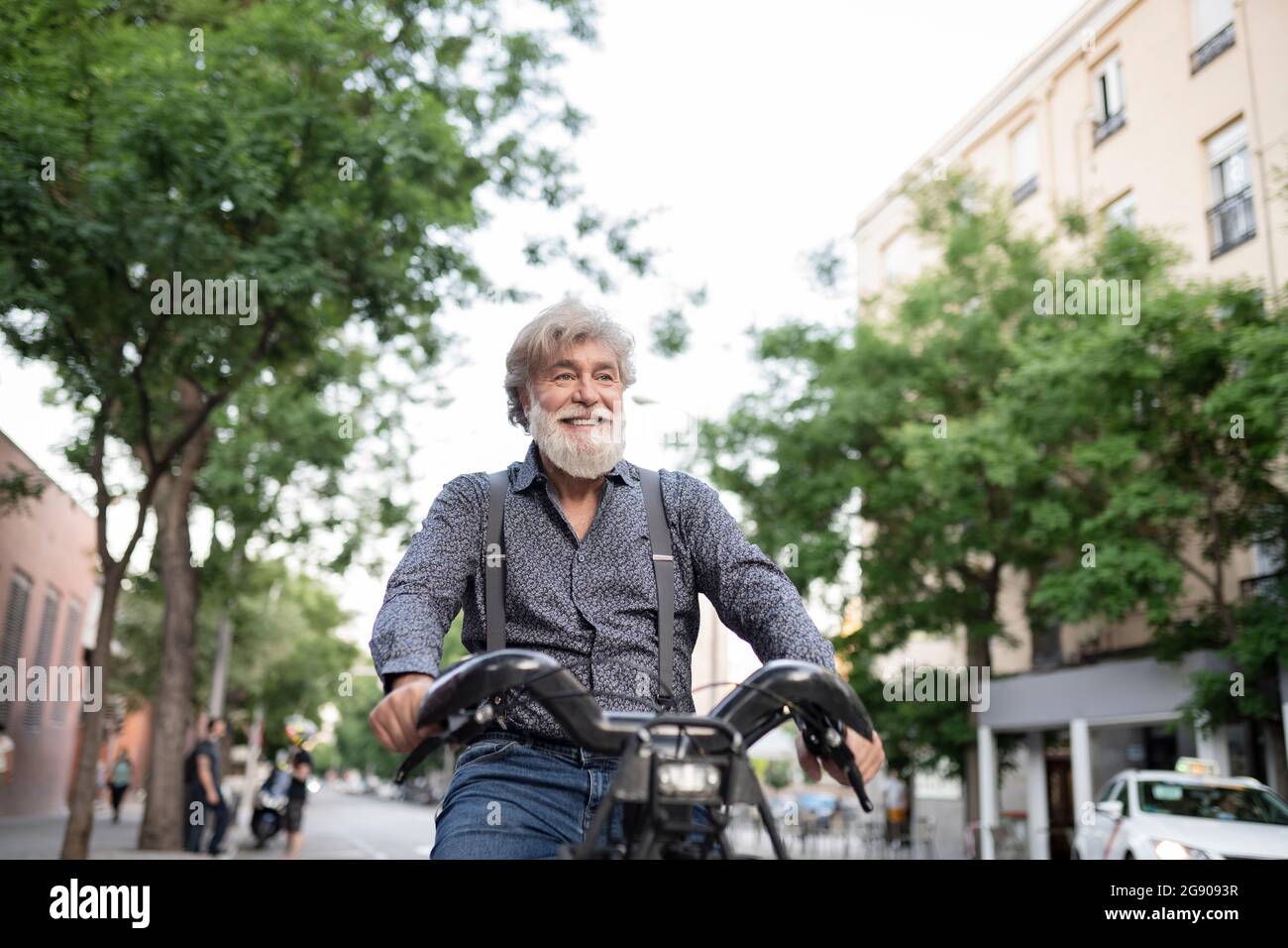 Man riding an electric bike hi-res stock photography and images - Alamy