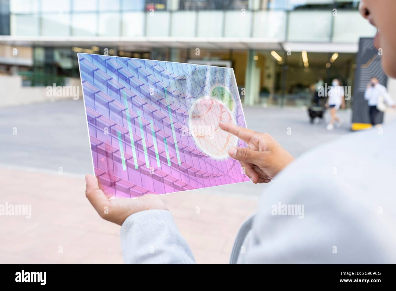 Female professional using futuristic glass tablet Stock Photo - Alamy