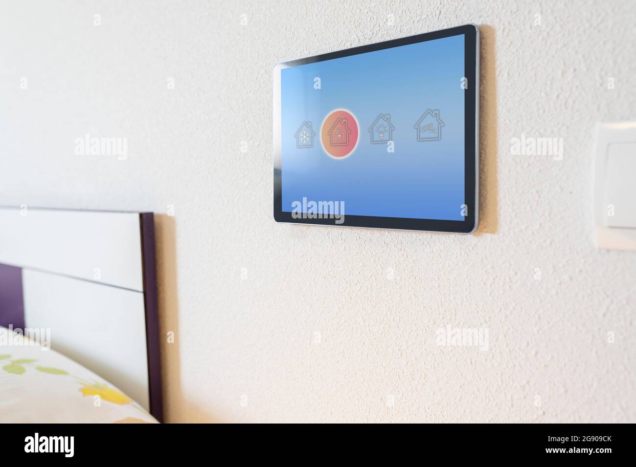 Smart home tablet with wifi icon on wall Stock Photo - Alamy