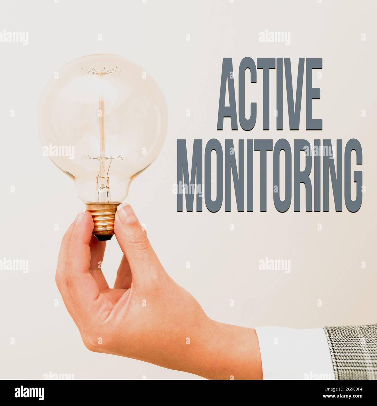 Hand writing sign Active Monitoring. Word Written on person incharge go ...