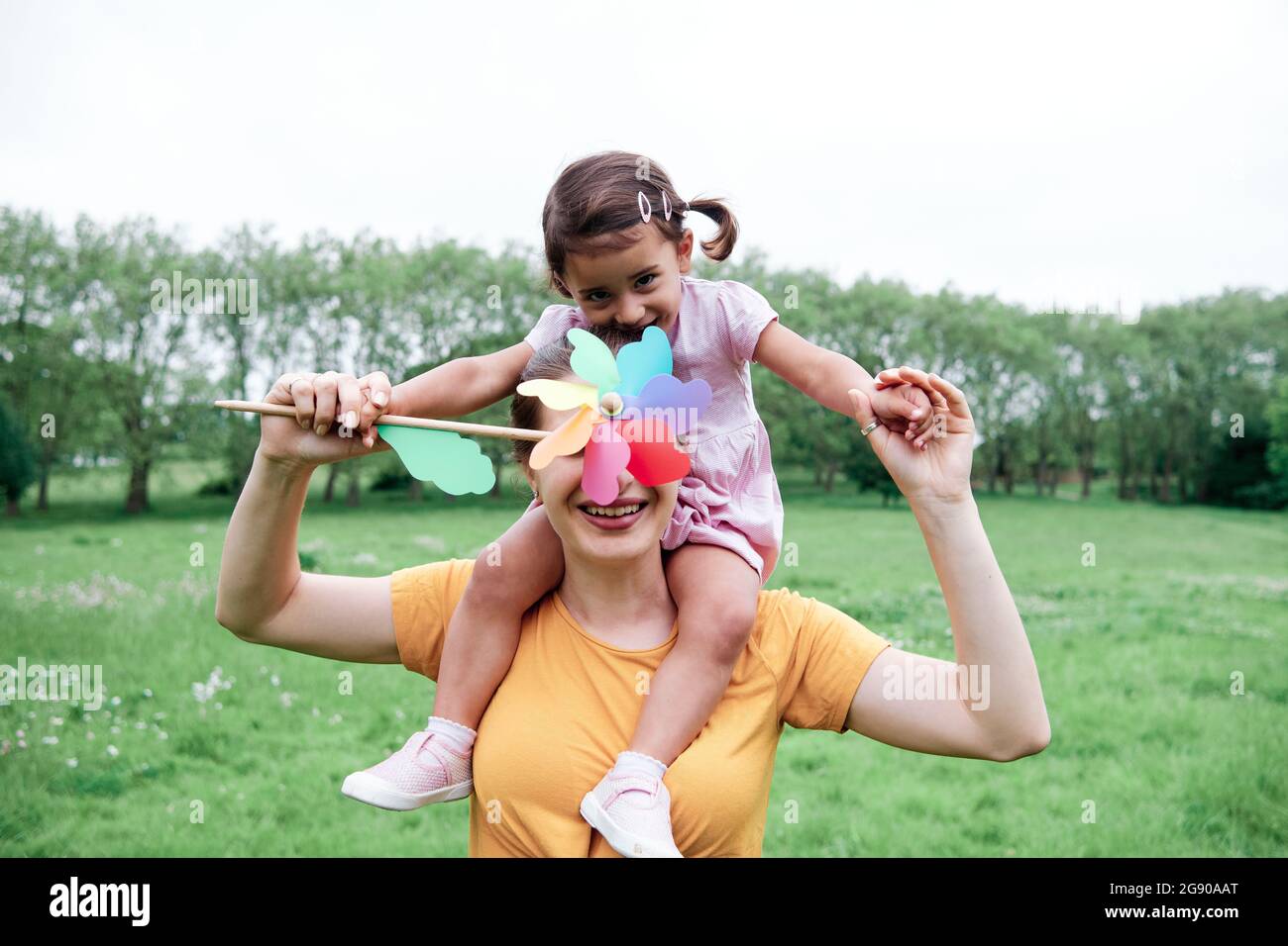 Girl with a pinwheel hi-res stock photography and images - Alamy