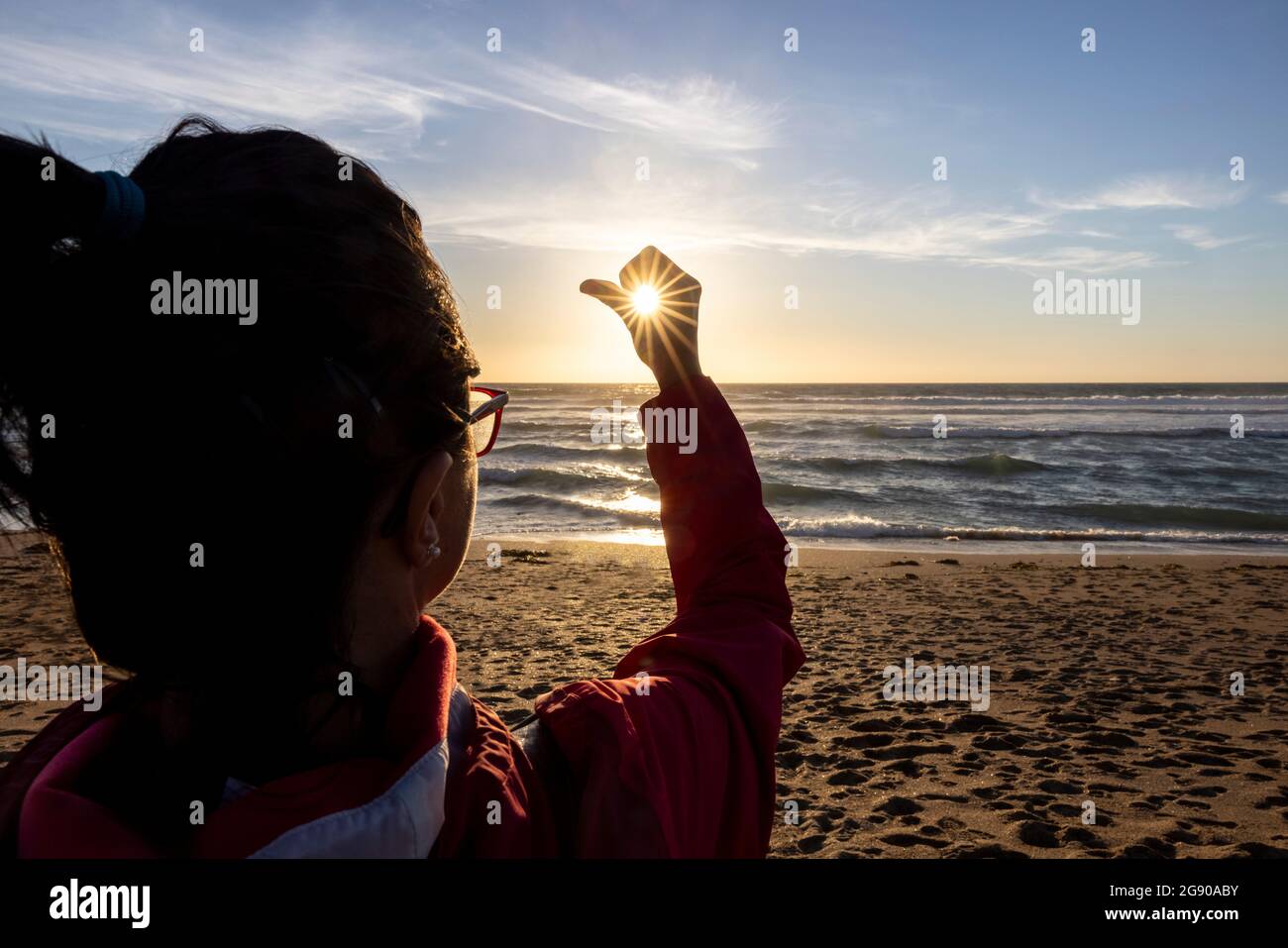 Woman holding the sun hi-res stock photography and images - Alamy