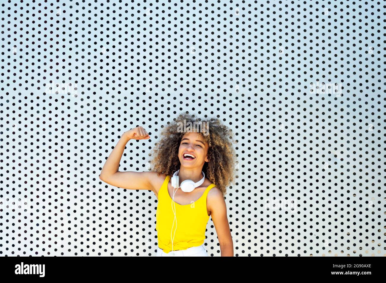 Laughing flexing muscles hi-res stock photography and images - Alamy