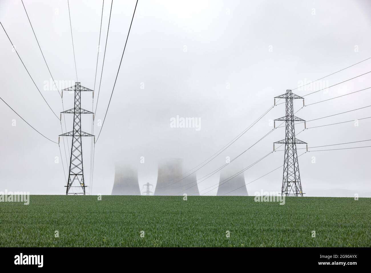 Field electricity pylons and cooling towers background hi-res stock ...