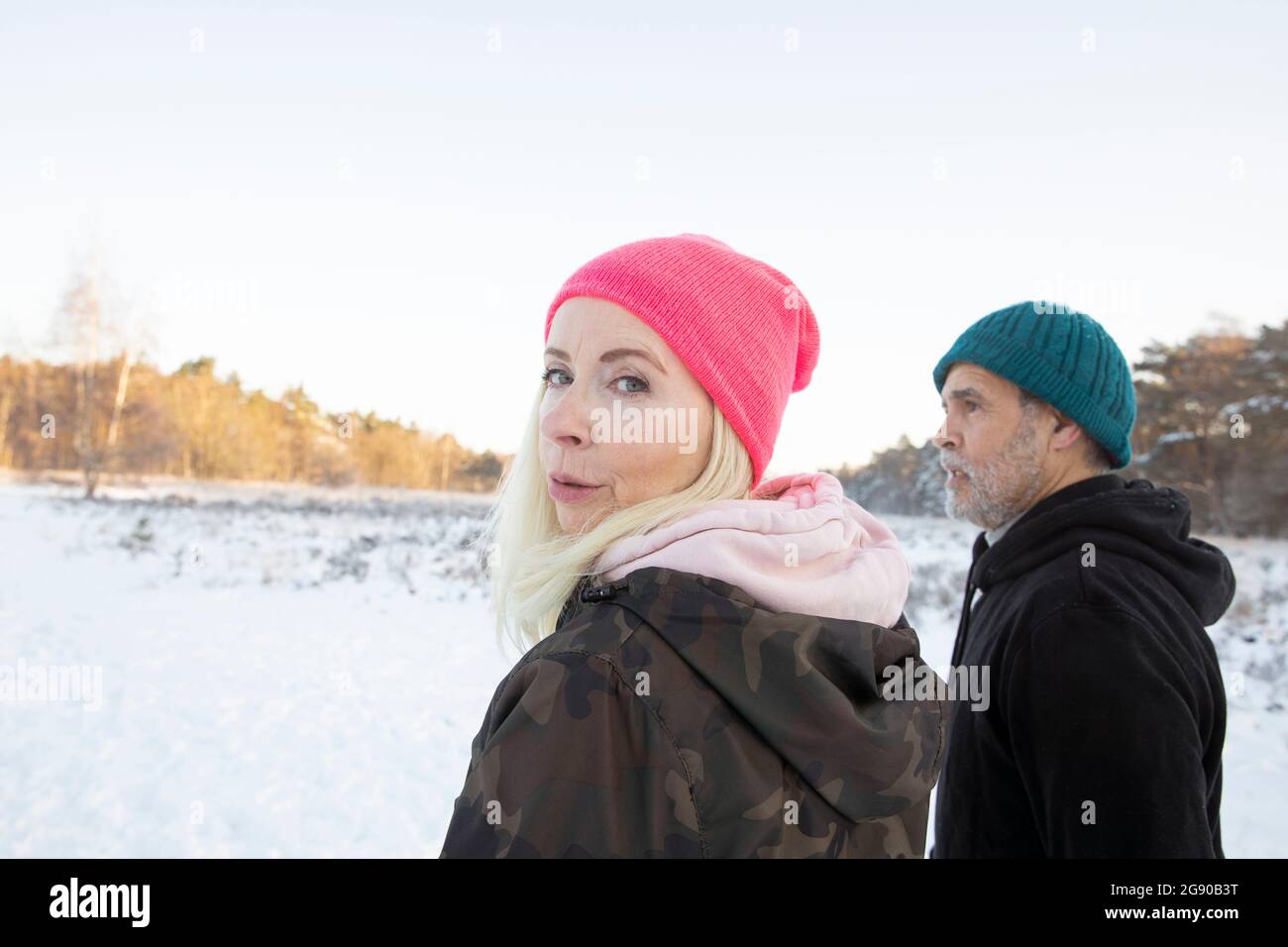 Woman looking over shoulder at man hi-res stock photography and images ...