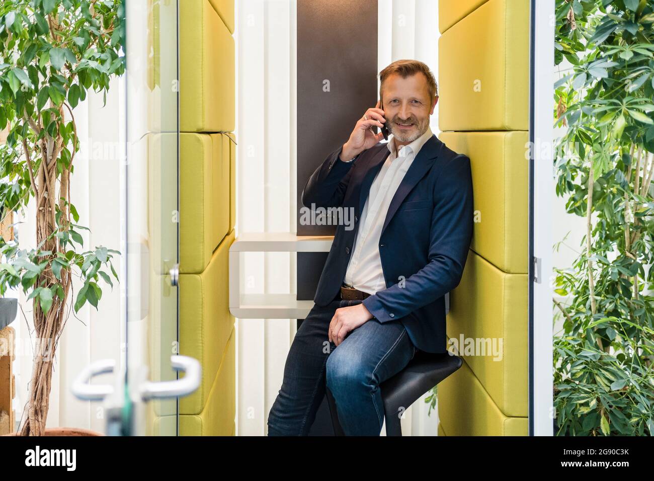 Sitting on phone booth hi-res stock photography and images - Alamy