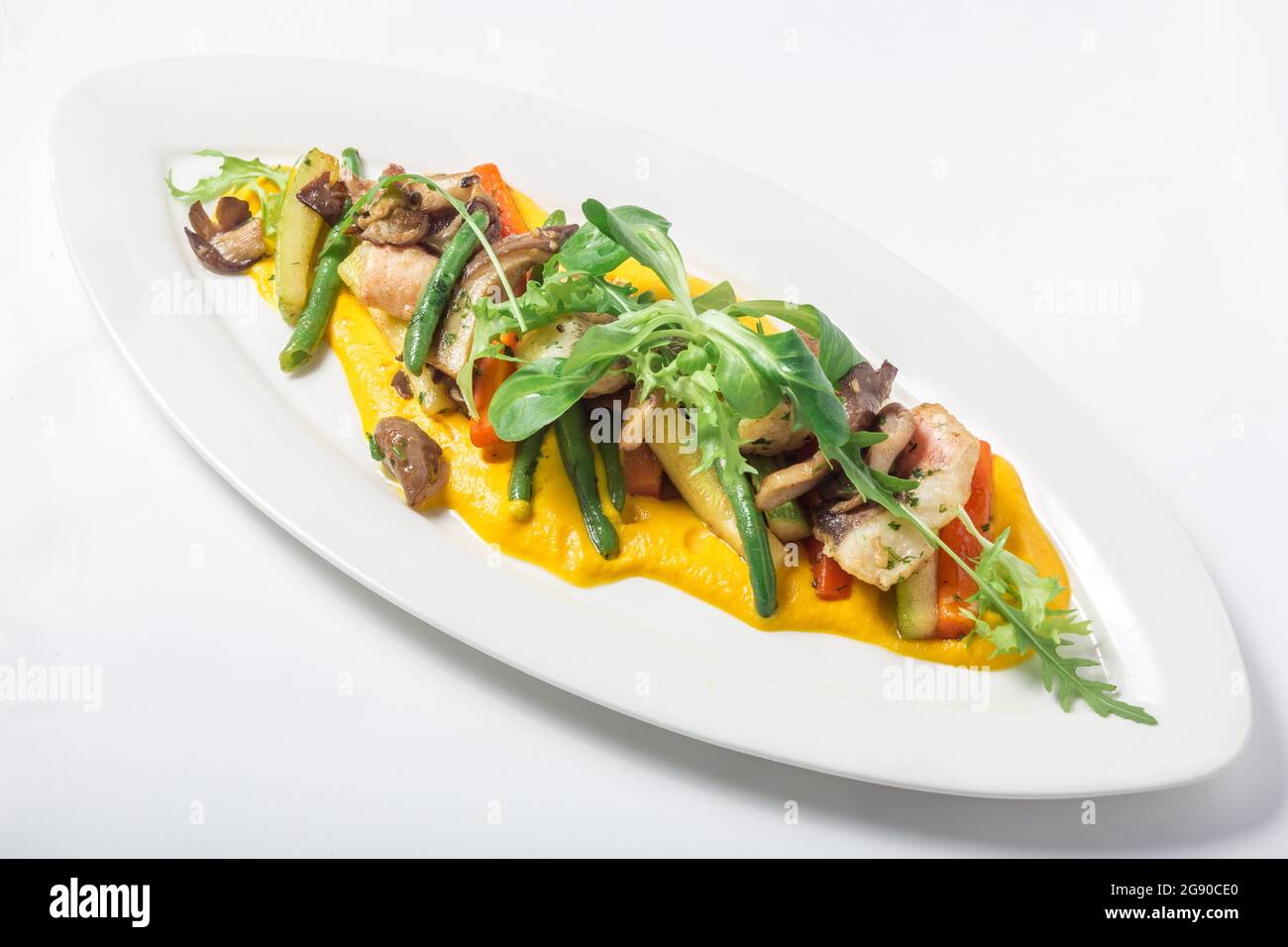 Baked fish King clip with vegetables and sauce. Close-up Stock Photo ...