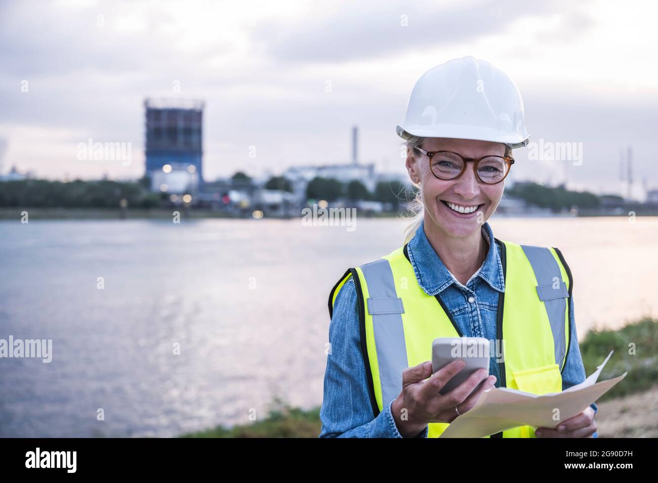 Happy female professional holding hi-res stock photography and images ...