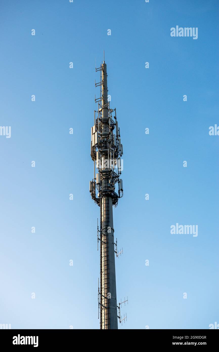Mobile phone transmitter against blue sky Stock Photo - Alamy