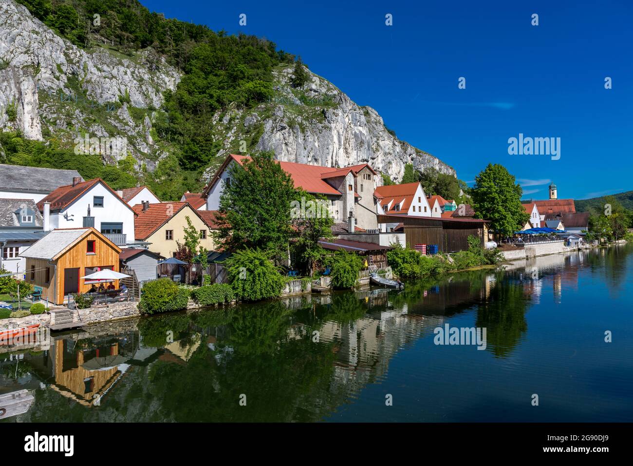Germany, Bavaria, Essing, Town on bank of Altmuhl river with steep ...