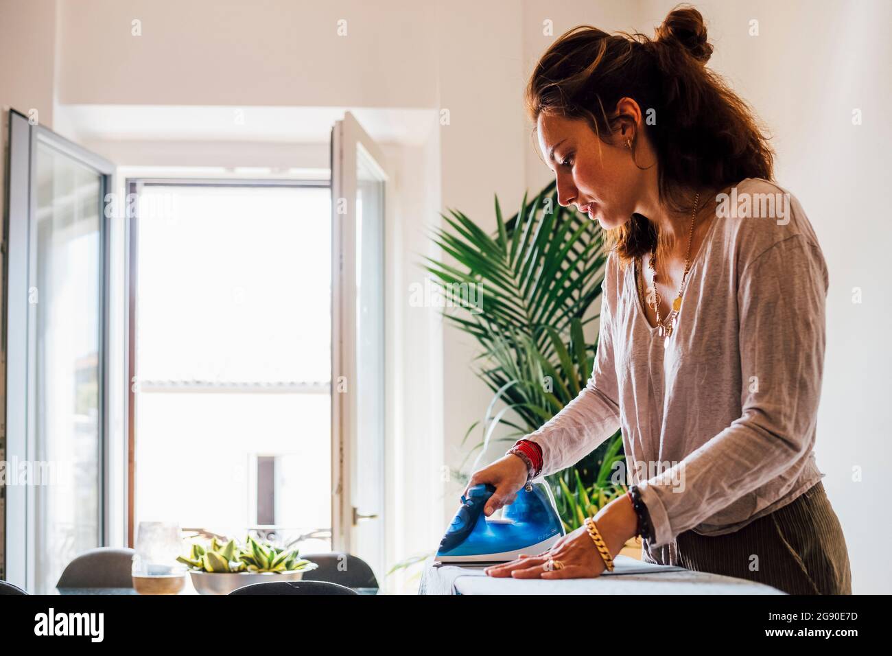 Ironing hair hi-res stock photography and images - Alamy