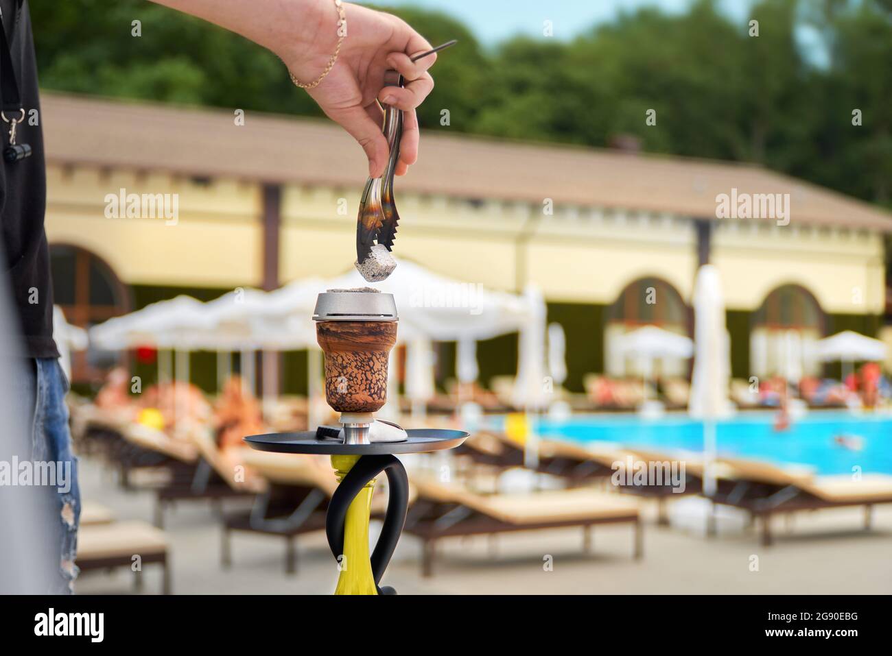 summer rest, smoke party concept - closeup hookah on pool background ...