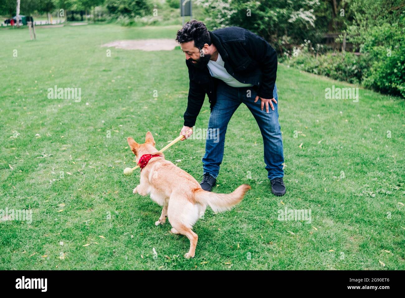 Man holding stick hi-res stock photography and images - Alamy