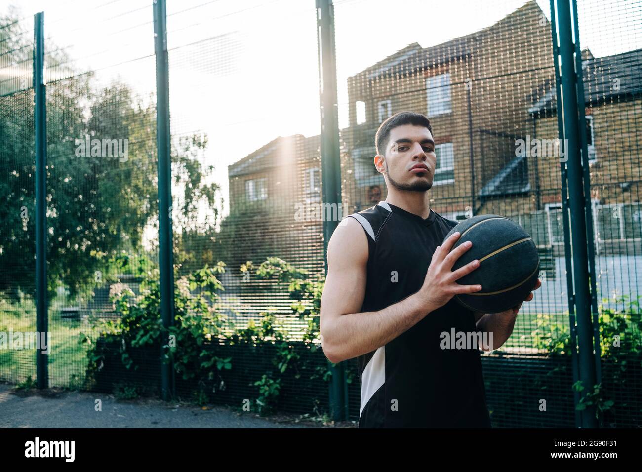 Serious basketball player at sports court Stock Photo - Alamy