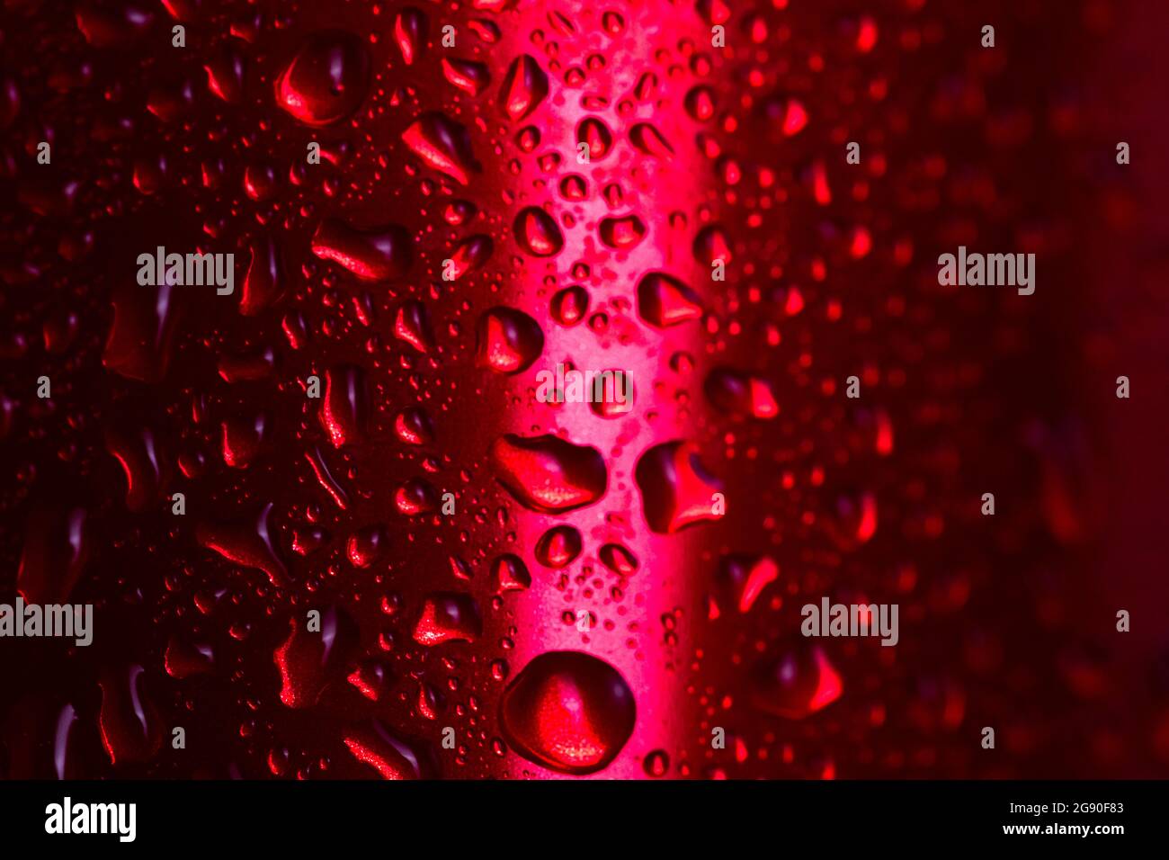 Water droplets on red metallic can Stock Photo - Alamy