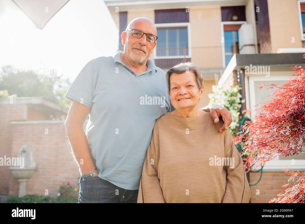 Arm around back view hi-res stock photography and images - Alamy