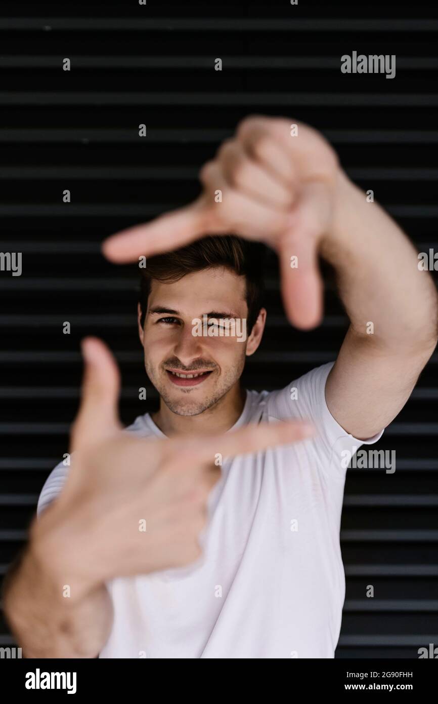 Man standing in front of roller shutter hi-res stock photography and ...