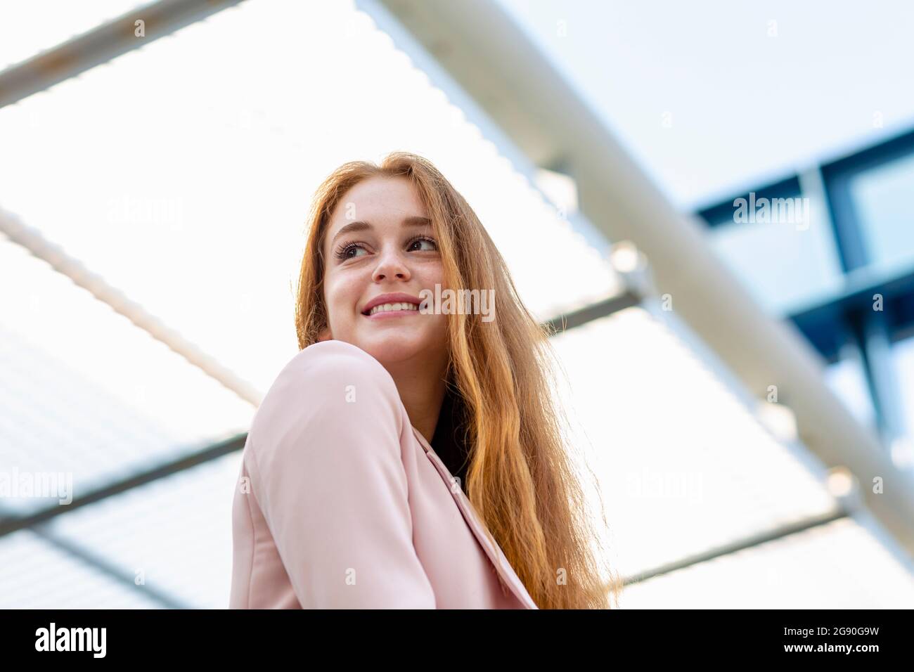 Beautiful female professional under shade at railway station Stock ...