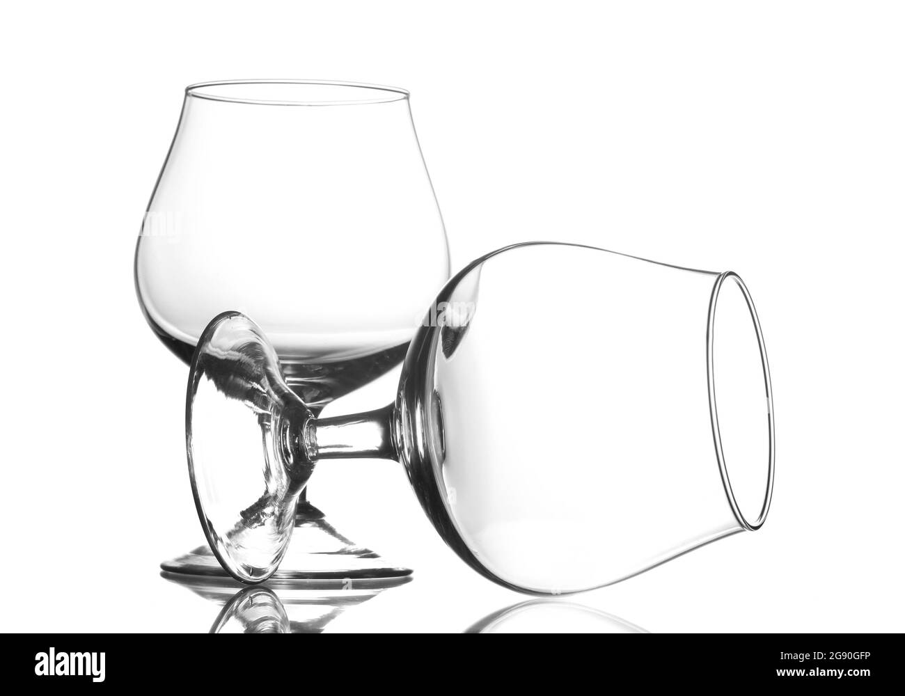 Two empty glasses isolated on white Stock Photo - Alamy