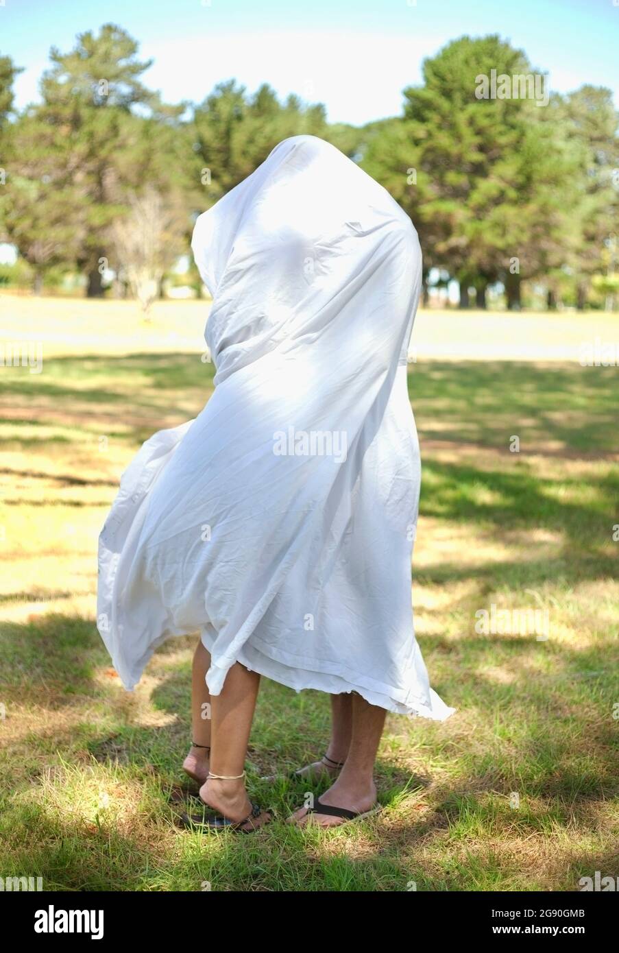 Couple under sheet hi-res stock photography and images - Alamy