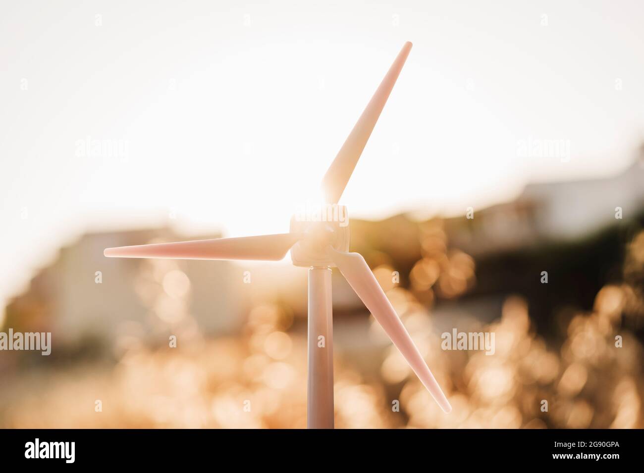 Small wind turbine model during sunset Stock Photo - Alamy
