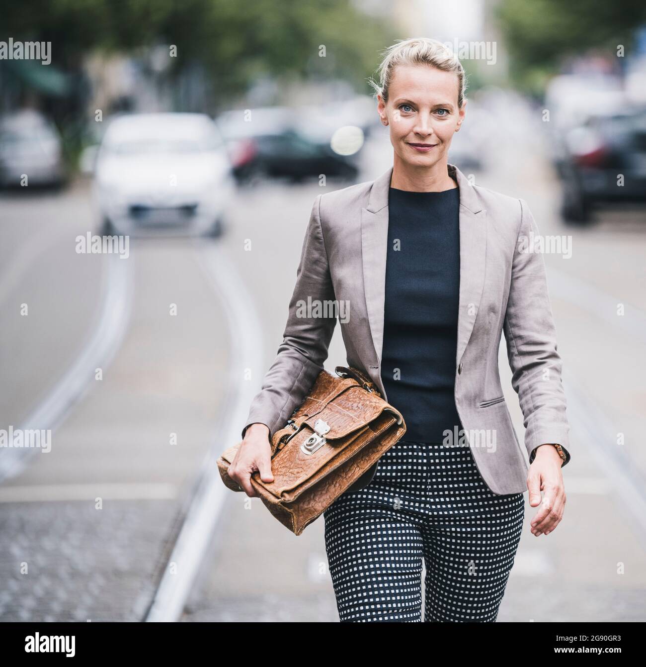 Female professional walking bag hi-res stock photography and images - Alamy