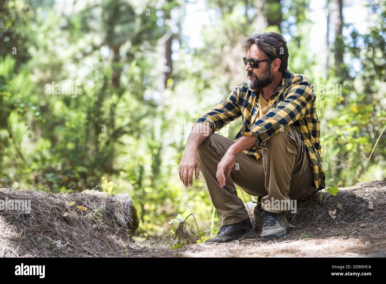 Man sitting in forest hi-res stock photography and images - Alamy