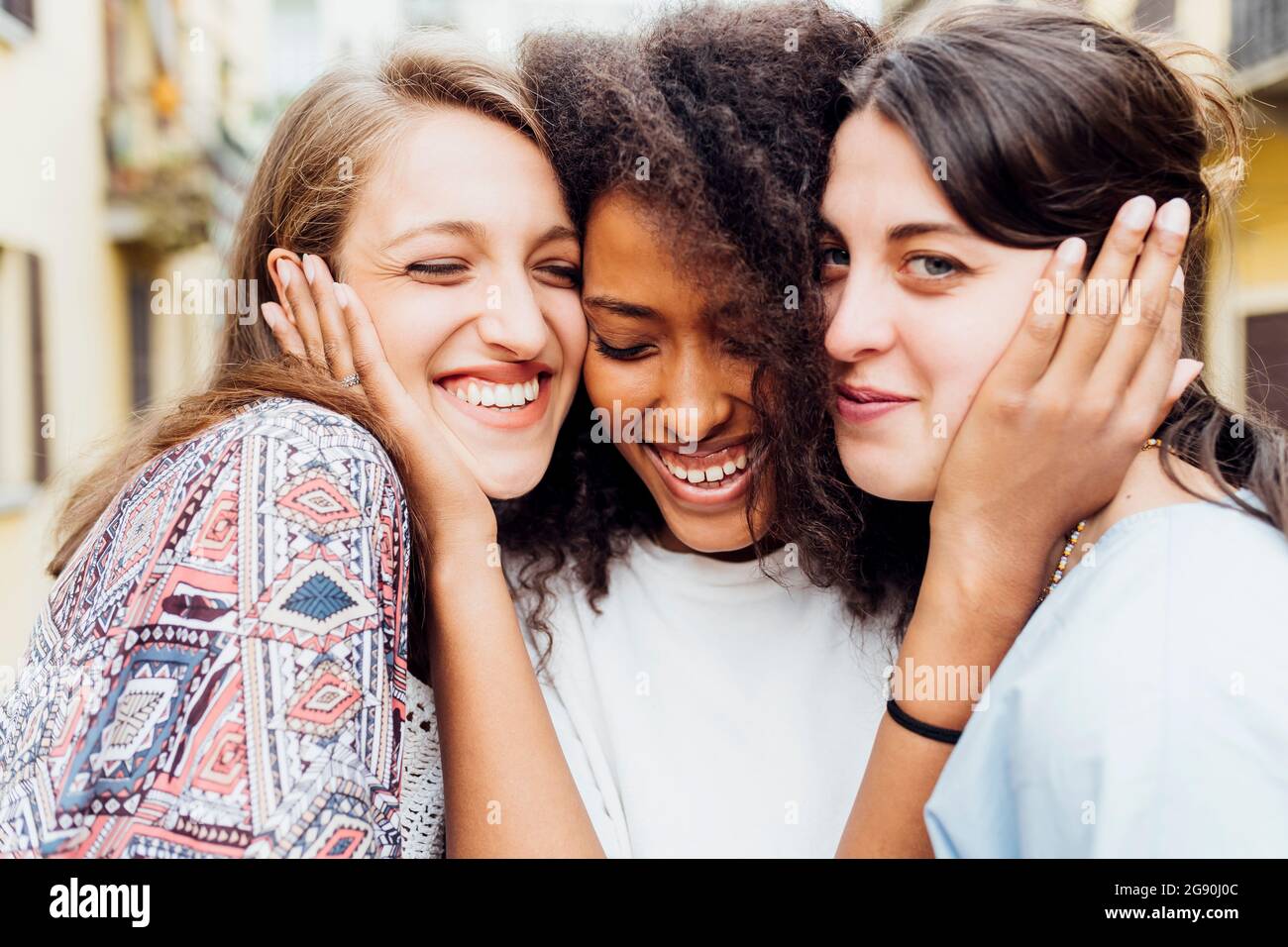 Multiethnic group friends embracing hi-res stock photography and images ...