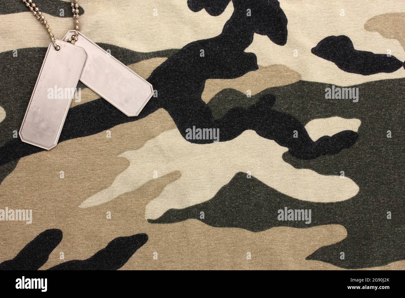 Army badges on camouflage background Stock Photo - Alamy