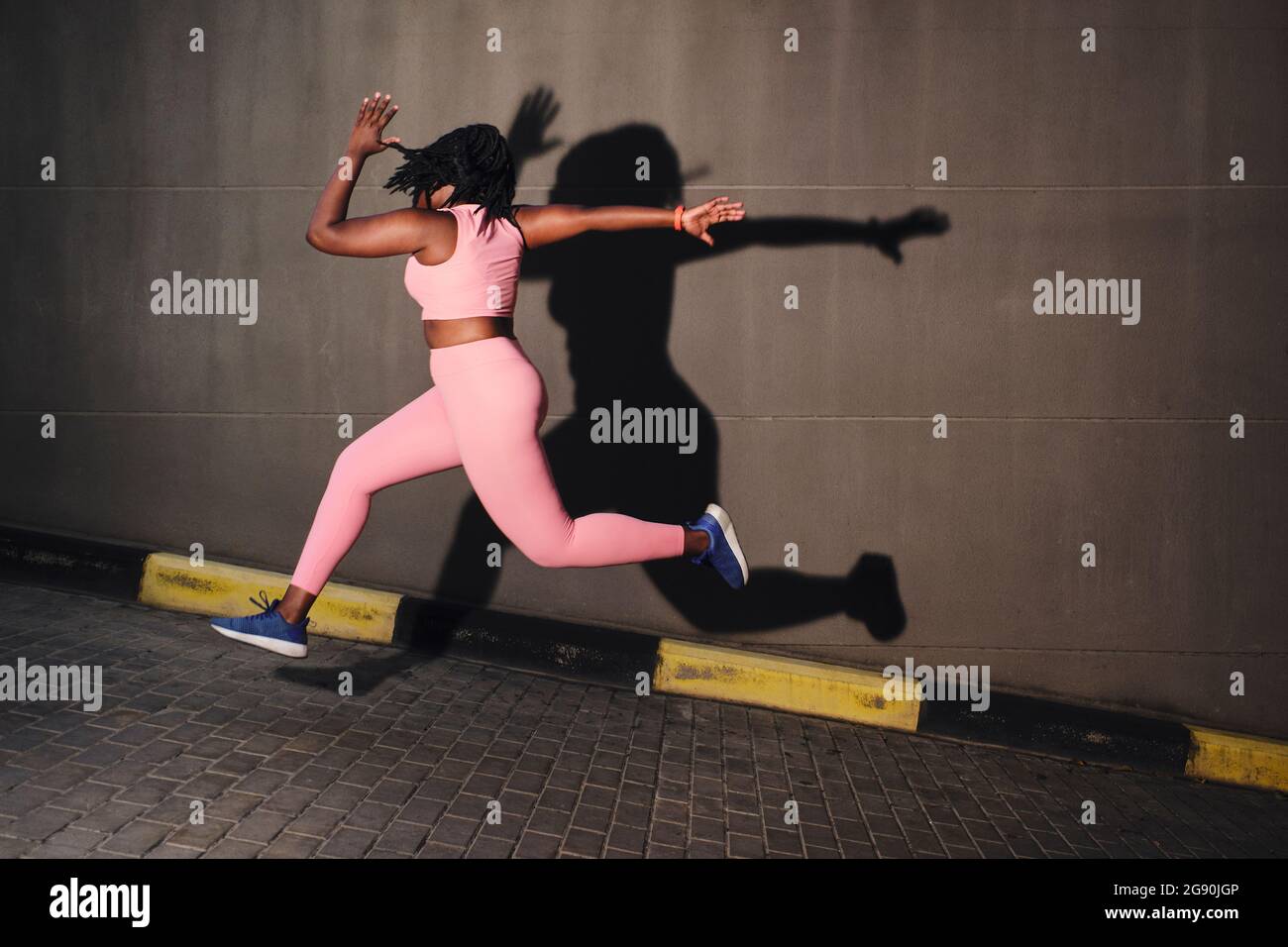 Full body young african woman jump hi-res stock photography and images ...