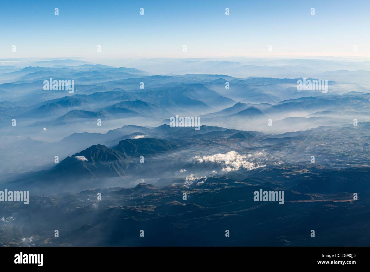 Aerial view of mountains shrouded in fog Stock Photo - Alamy