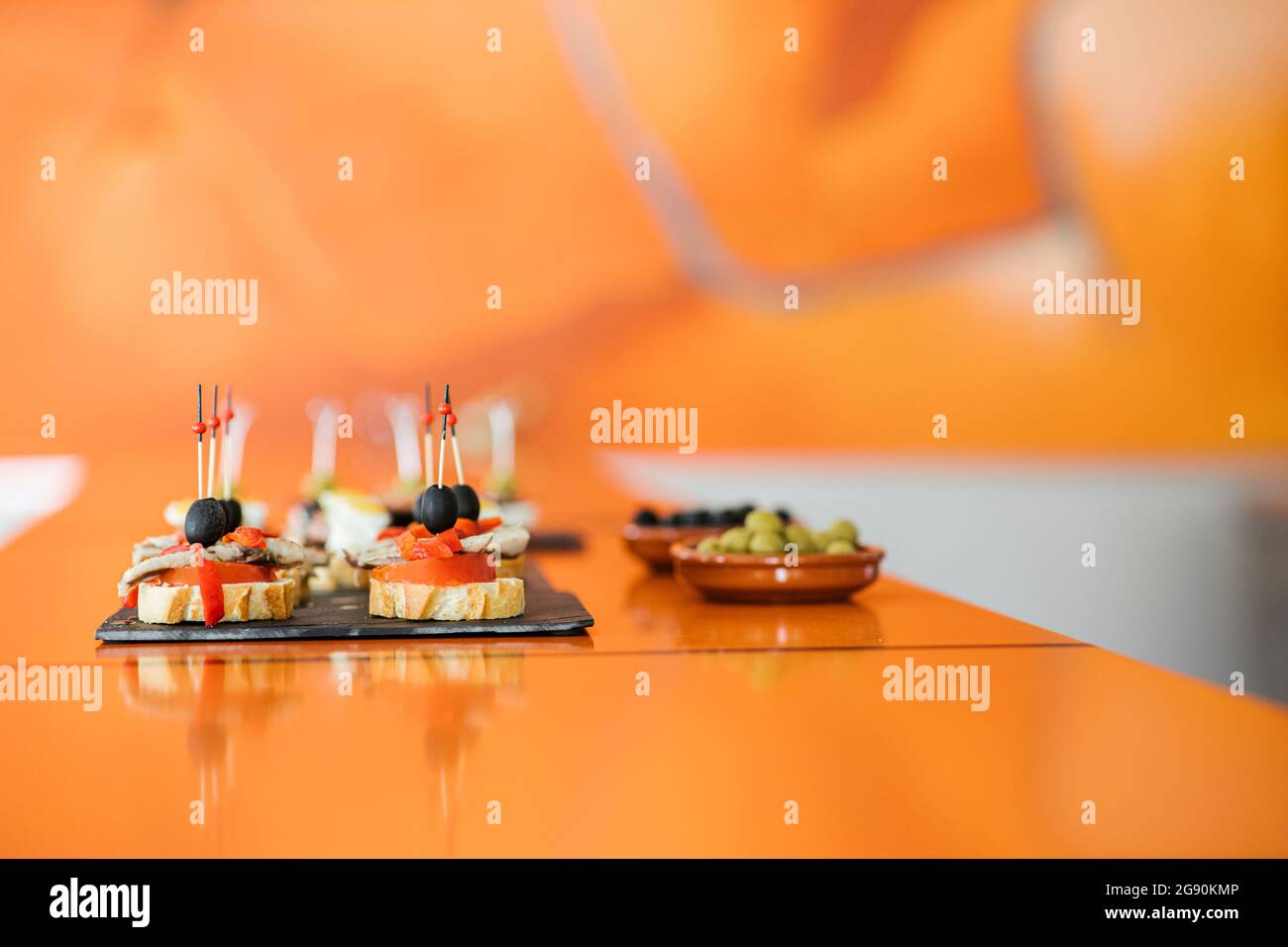 Sandwich on orange counter at restaurant Stock Photo - Alamy