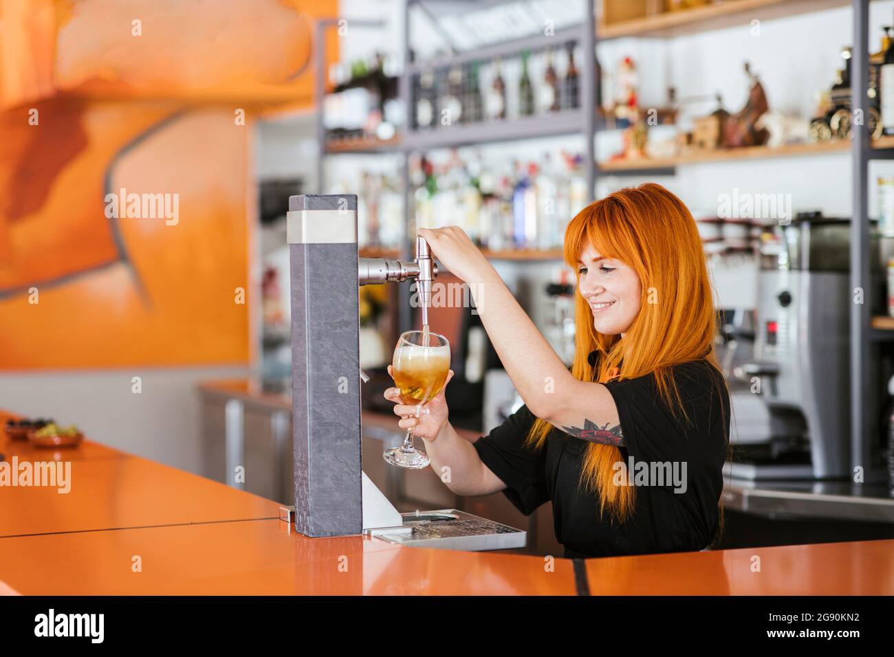 Woman filling glass beer from hi-res stock photography and images - Alamy
