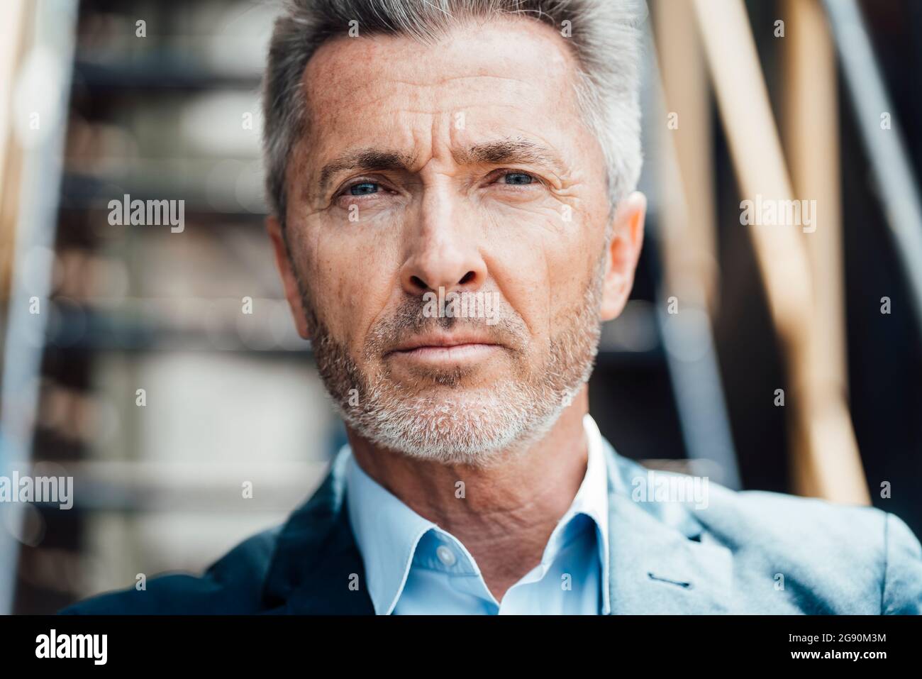 Businessman staring in industry Stock Photo - Alamy