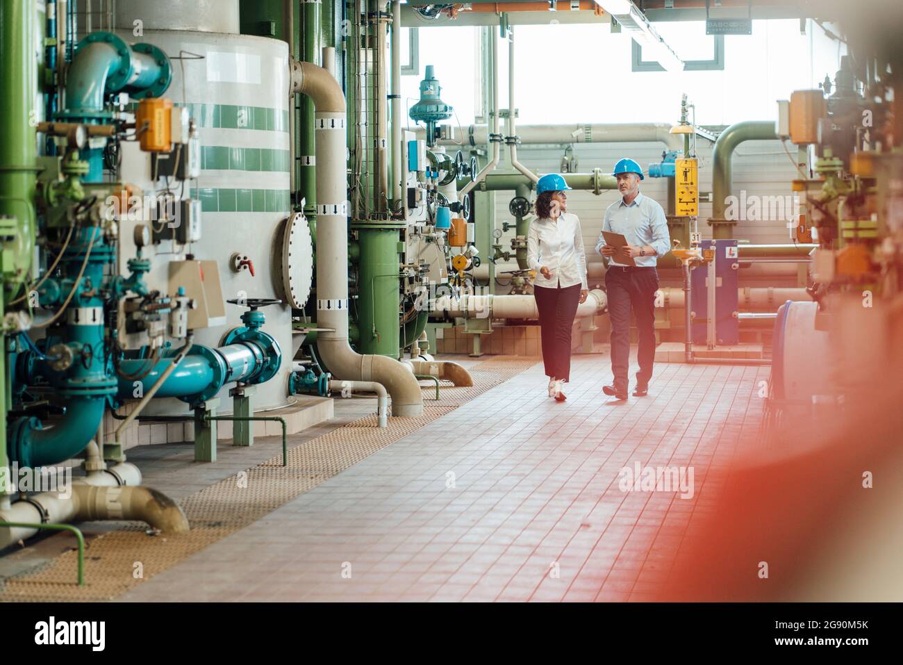 Male engineers walking talking on hi-res stock photography and images - Alamy