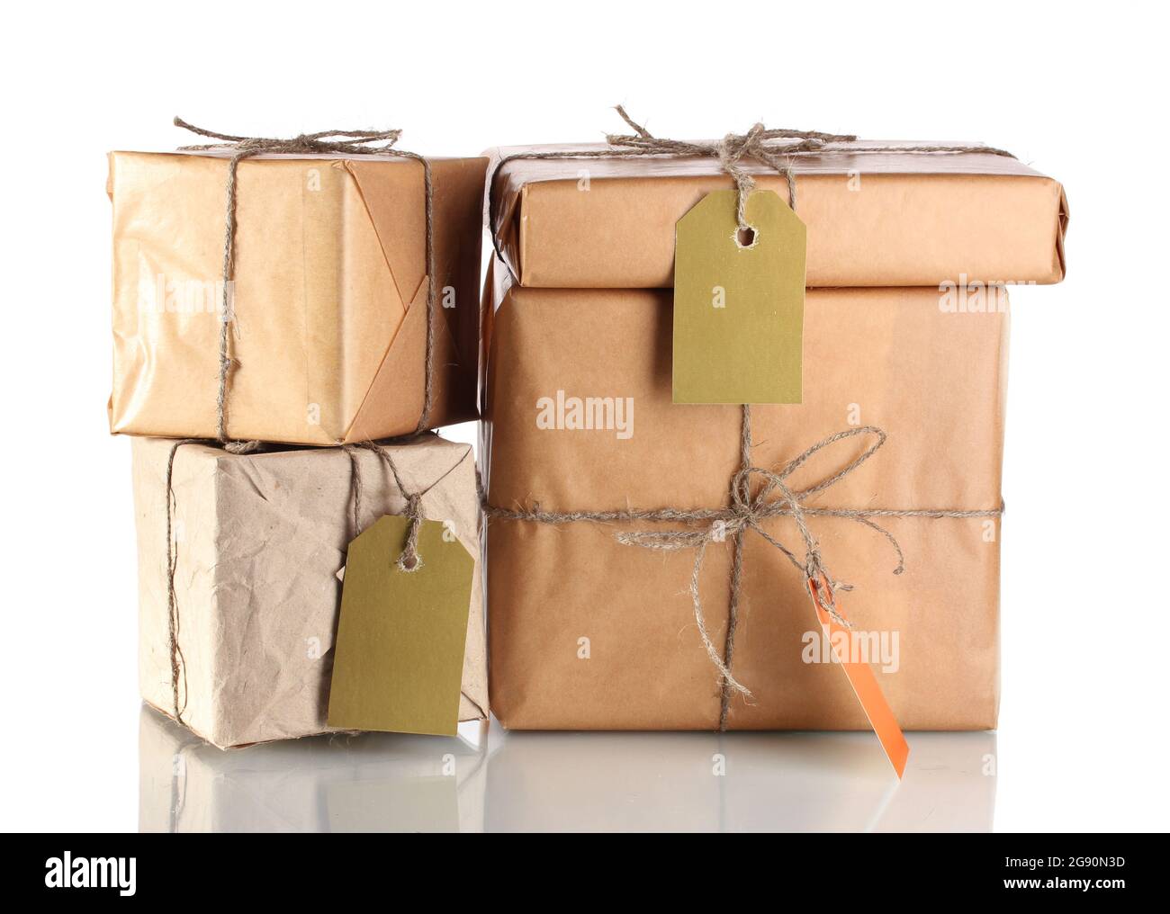 Many parcels wrapped in brown paper tied with twine and with blank ...
