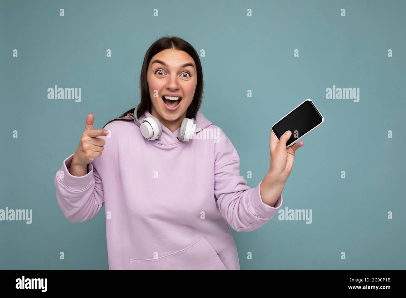 Photo of beautiful positive amazed young brunet woman wearing purple ...