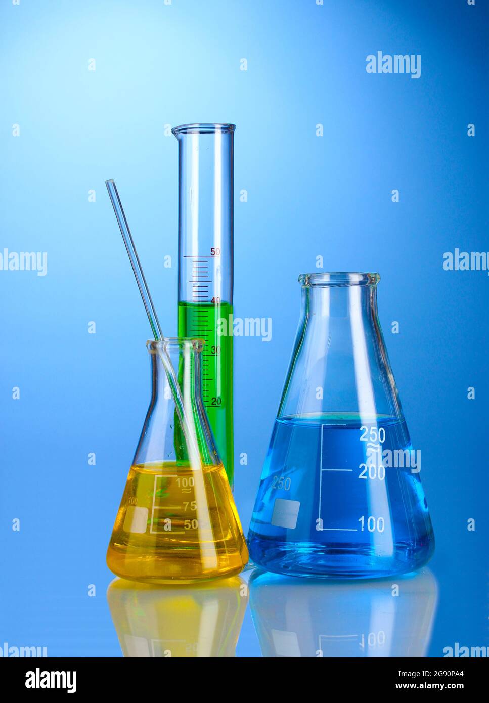 Three flasks with color liquid with reflection on blue background Stock ...