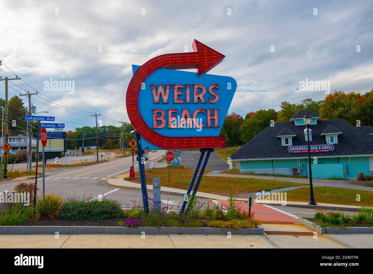 Entrance sign of Weirs Beach with neon lights in village of Weirs Beach ...